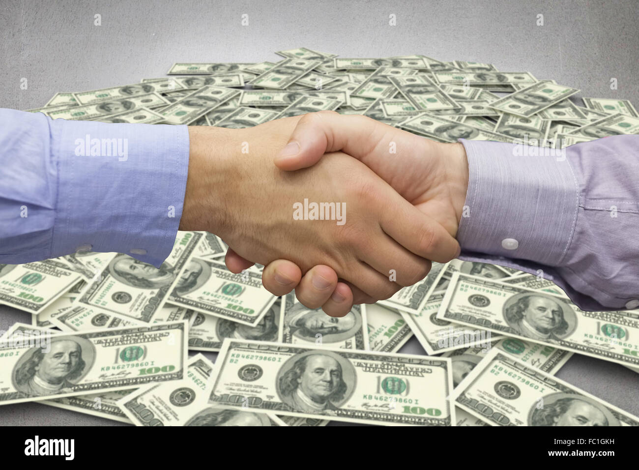 Composite image of hand shake in front of wires Stock Photo - Alamy