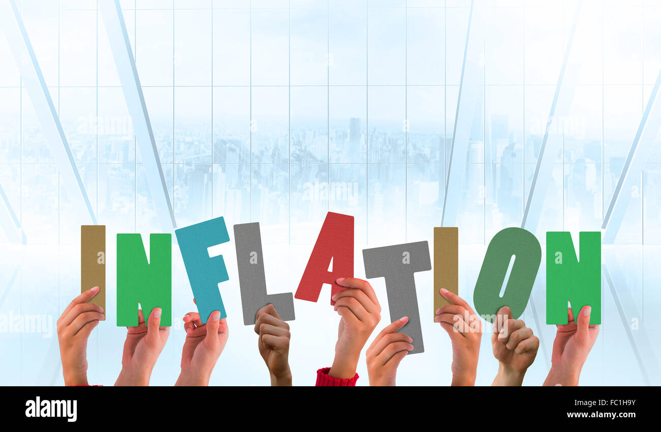 Composite image of hands holding up inflation Stock Photo - Alamy