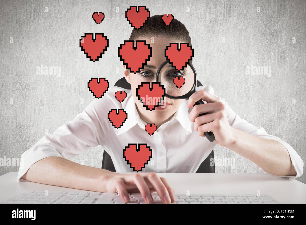 Composite image of businesswoman typing and looking through magnifying ...