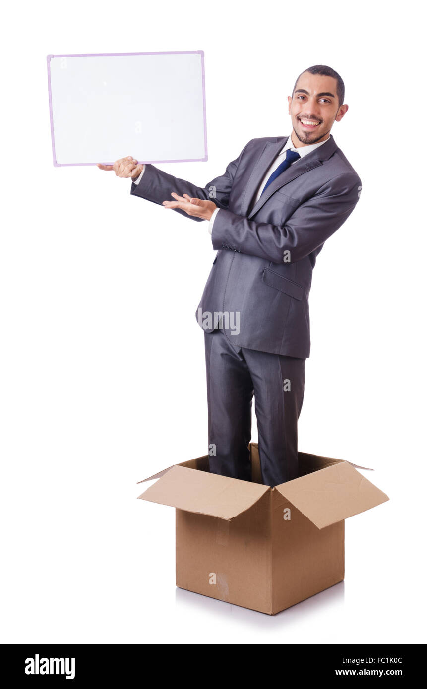 Businessman standing in the box isolated on white Stock Photo - Alamy