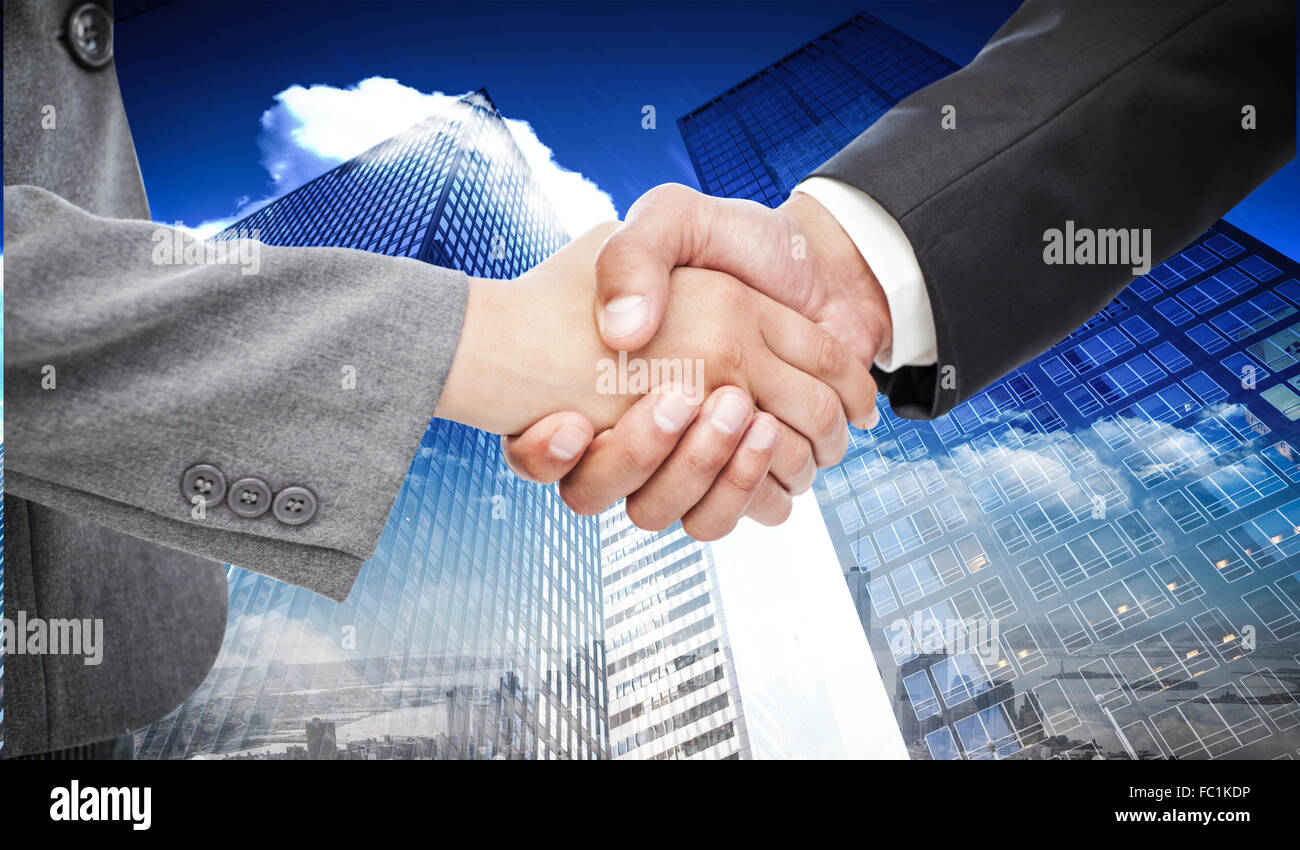Composite image of handshake between two business people Stock Photo ...