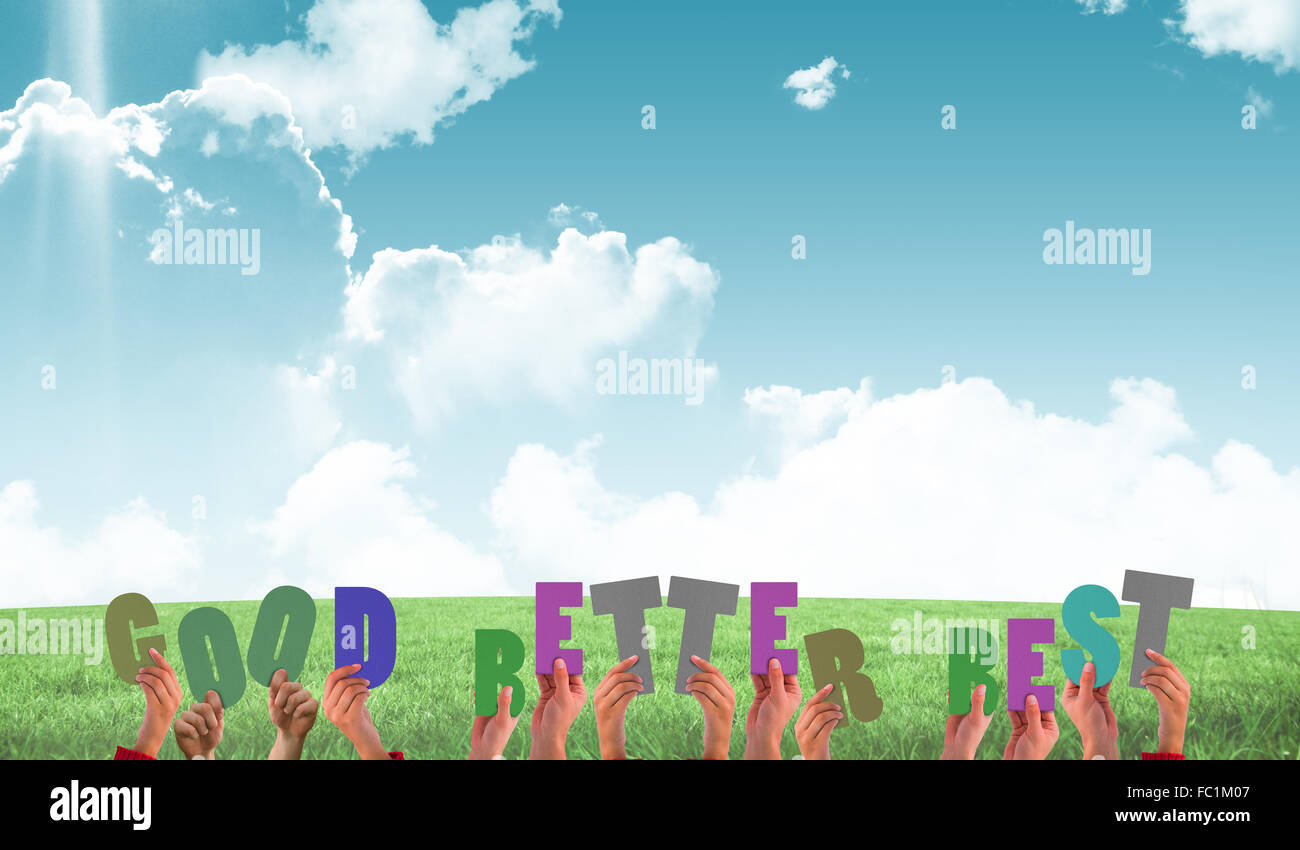 Composite image of hands holding up good better best Stock Photo - Alamy