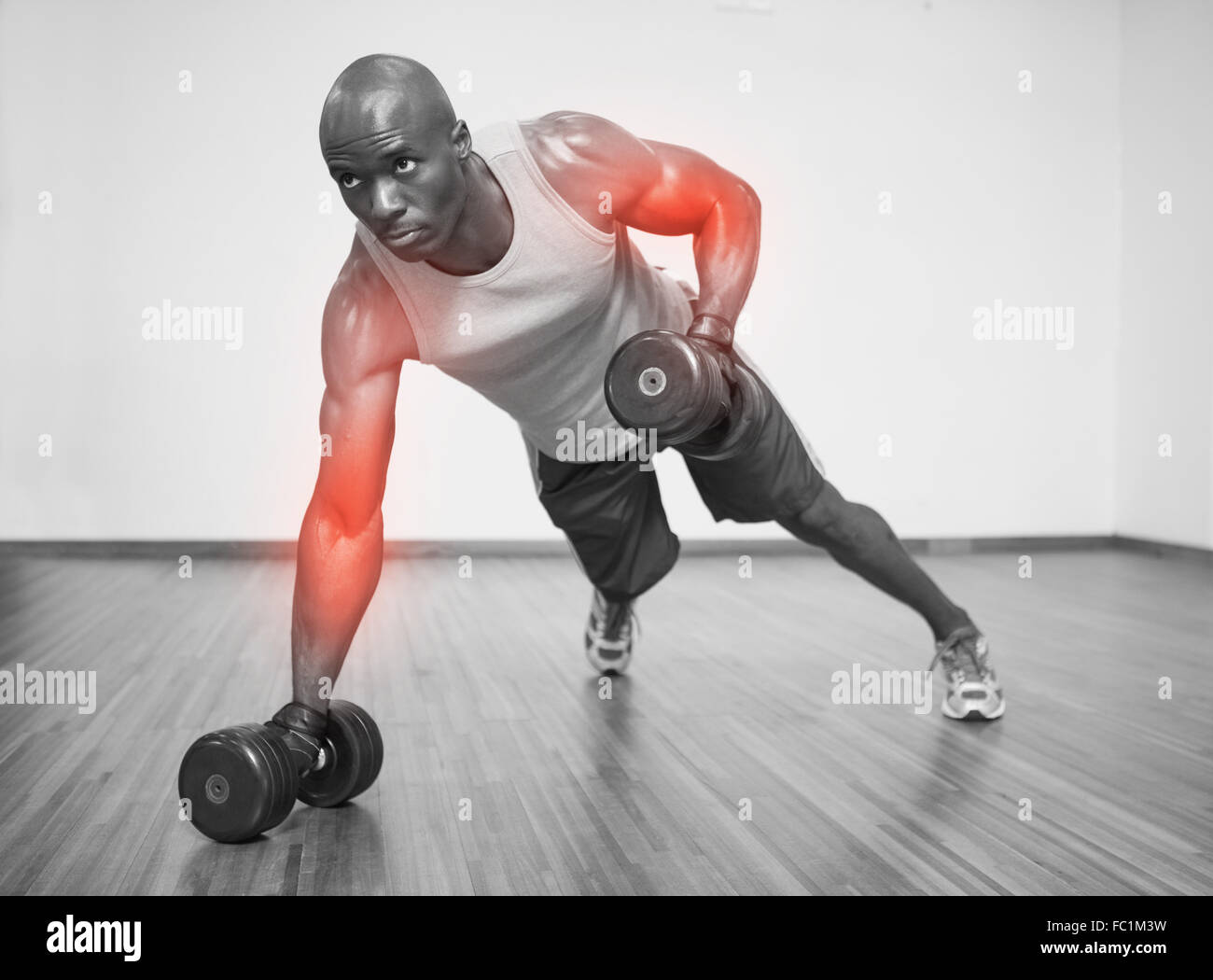 Highlighted arm of strong man lifting weights Stock Photo - Alamy
