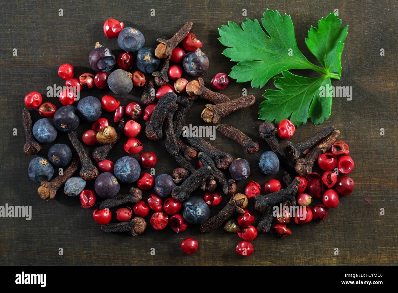 Red Pepper and Juniper Berries Stock Photo - Alamy