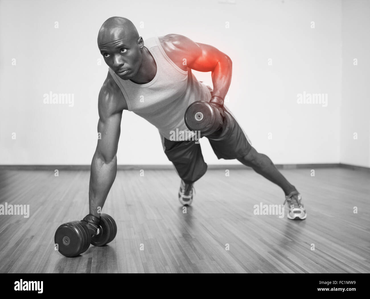 Highlighted arm of strong man lifting weights Stock Photo - Alamy