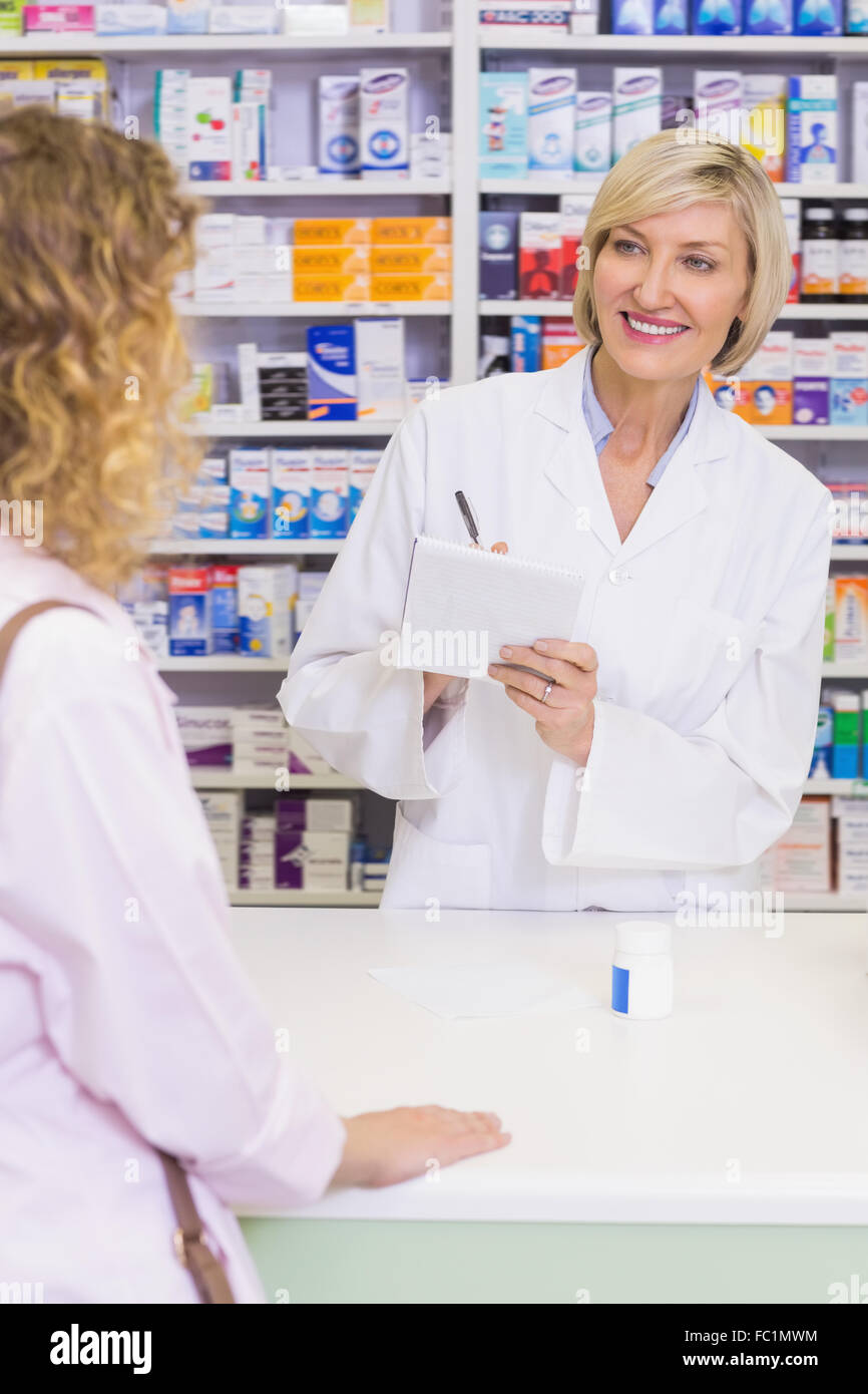 Pharmacist writing prescription hi-res stock photography and images - Alamy