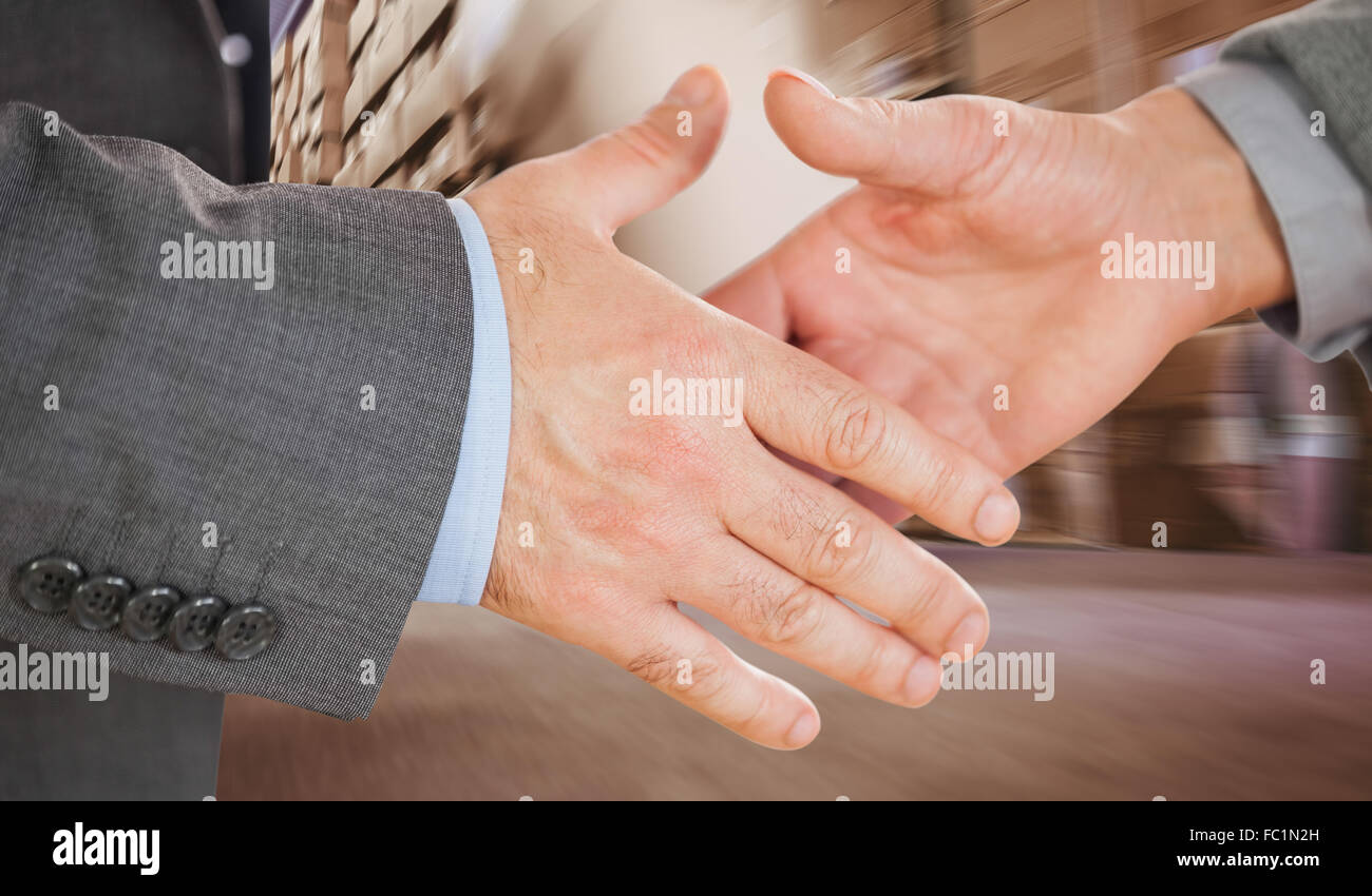 Composite image of two people going to shake their hands Stock Photo ...