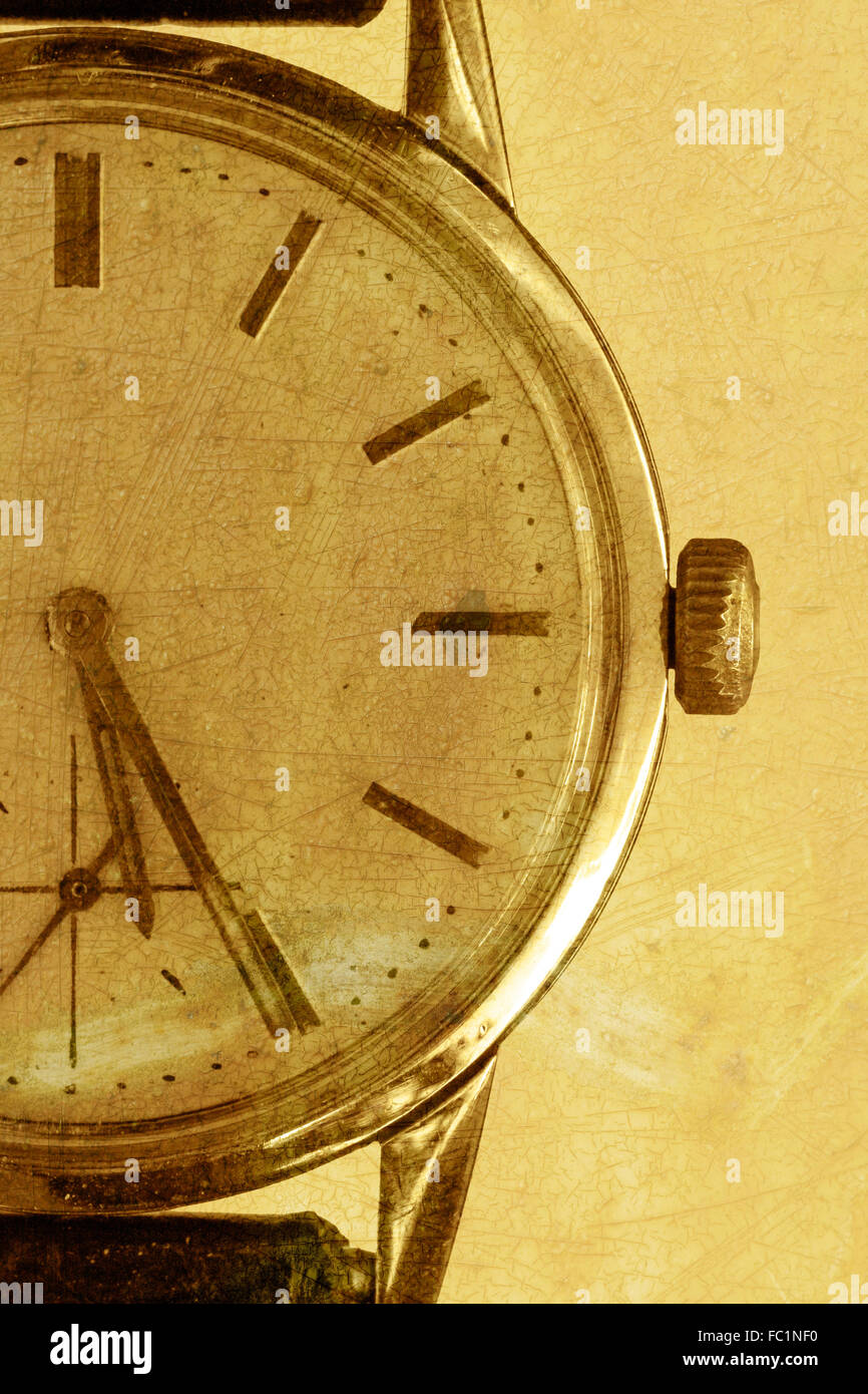Old watch on a gold grunge background Stock Photo - Alamy