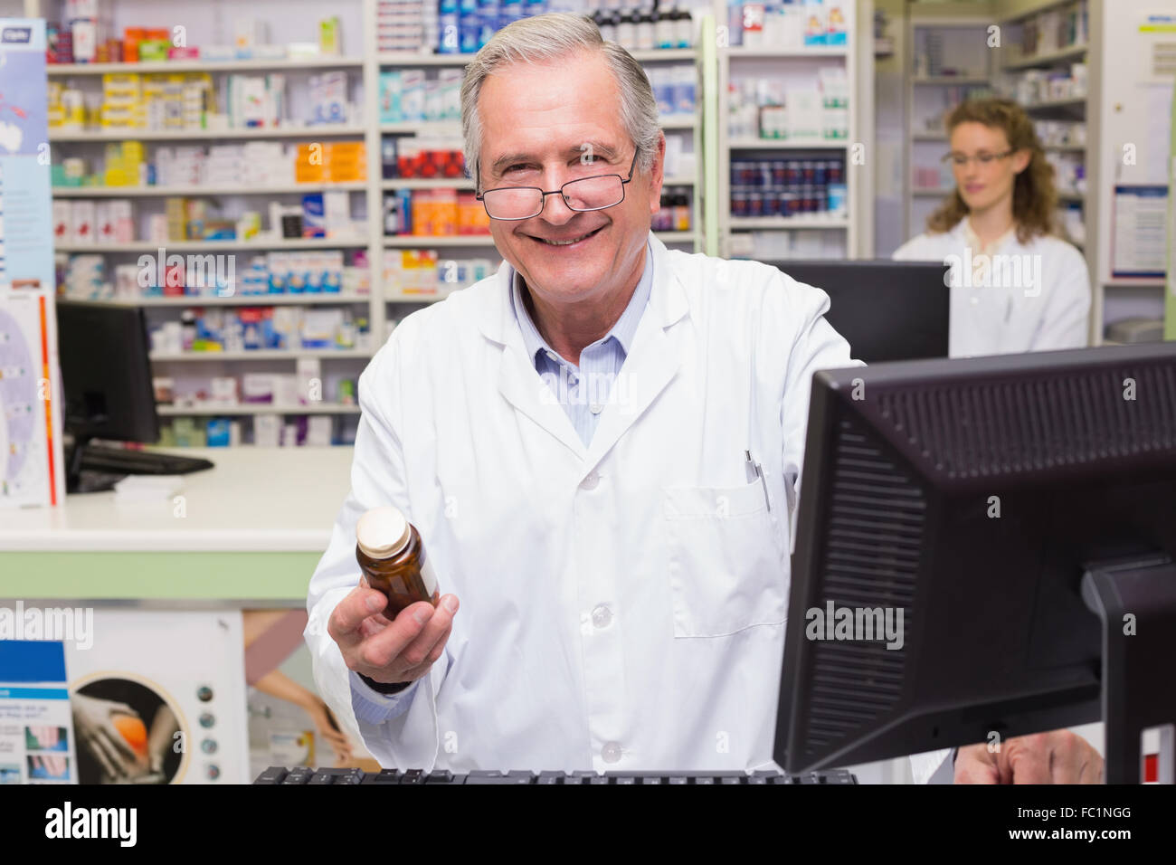 Female pharmacist looking computer screen hi-res stock photography and ...