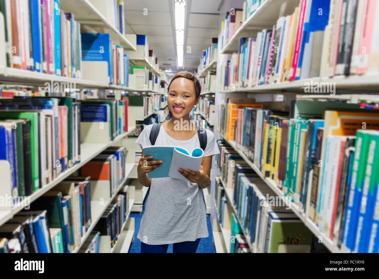 beautiful African American college girl in library Stock Photo - Alamy