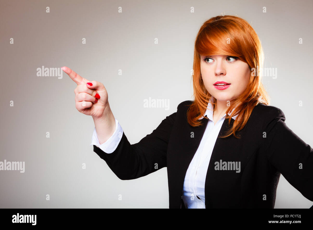 business woman pointing with finger Stock Photo - Alamy