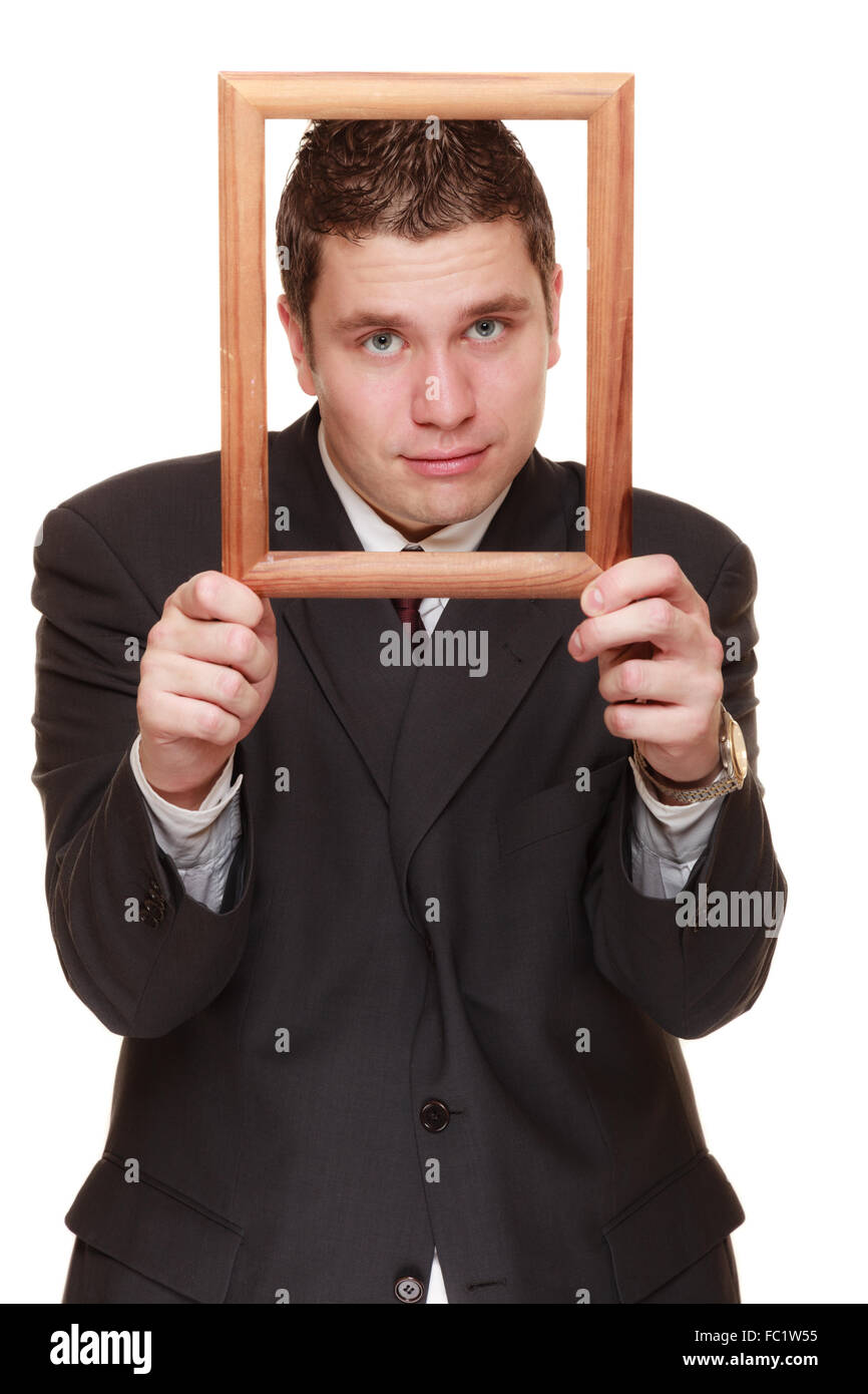 Business man framing his face with wood frame Stock Photo - Alamy