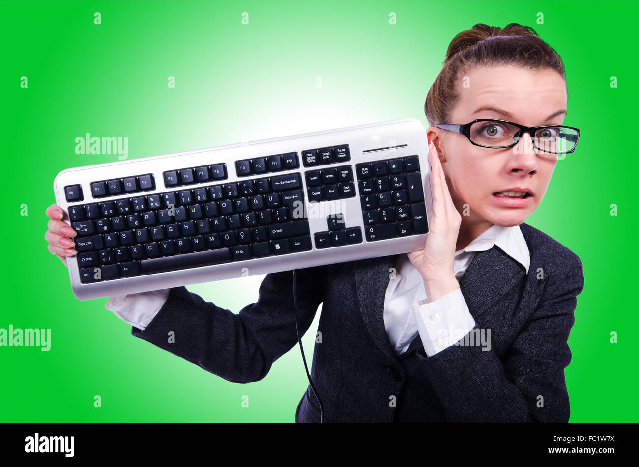 Nerd businessman with computer keyboard on white Stock Photo - Alamy