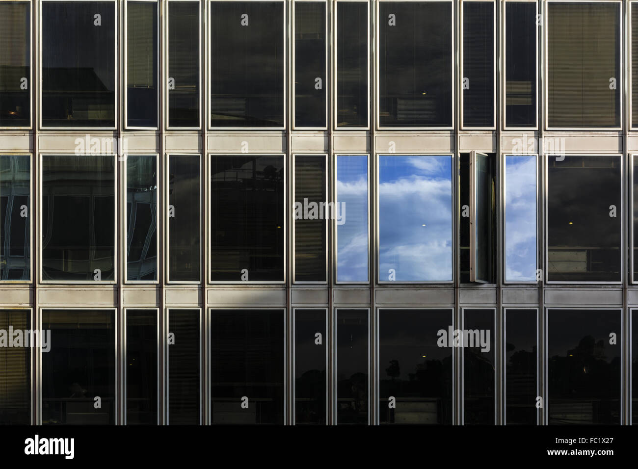 Clouds reflected on windows Stock Photo - Alamy