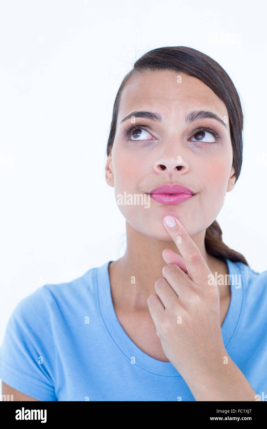 Woman eyes up finger on chin hi-res stock photography and images - Alamy