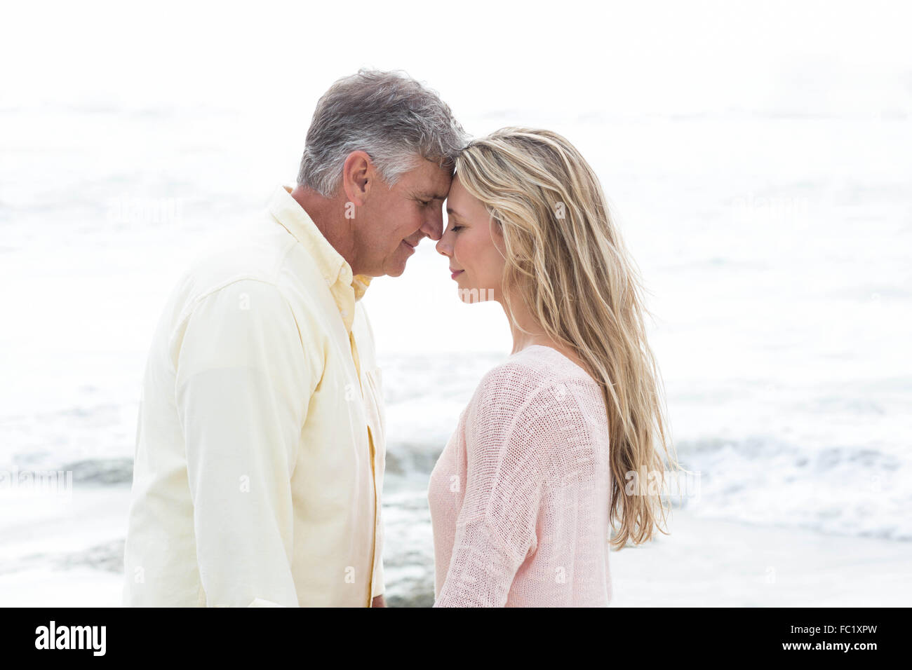 Happy couple holding hands and hugging each other Stock Photo - Alamy