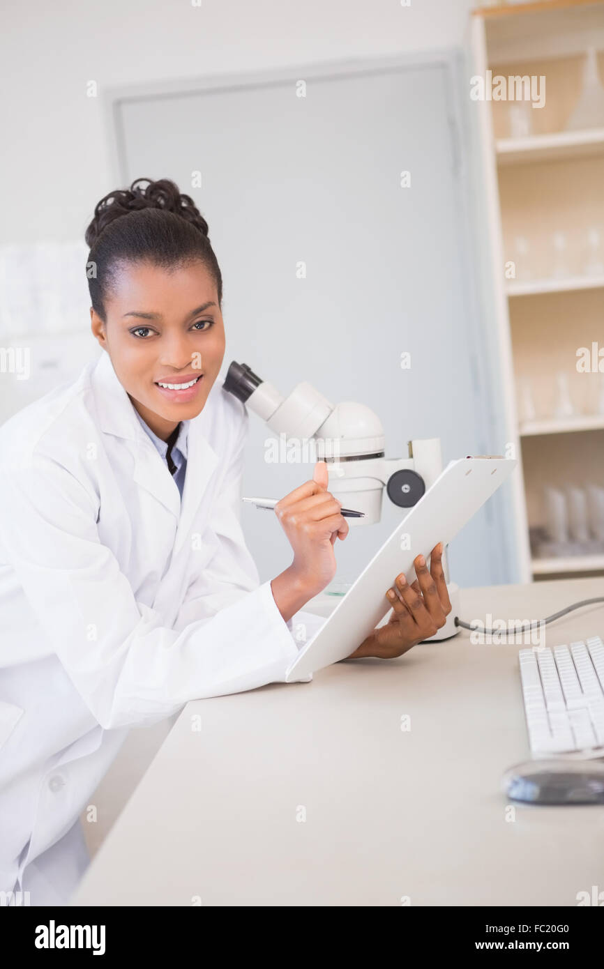 Woman taking notes observing hi-res stock photography and images - Alamy