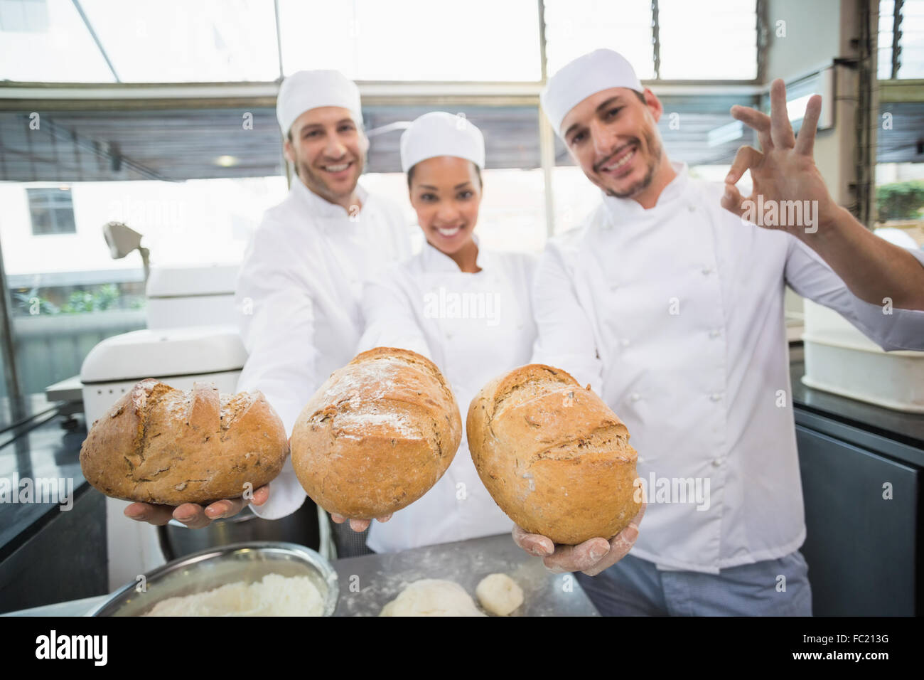 Hotel staff standing together smiling hi-res stock photography and ...