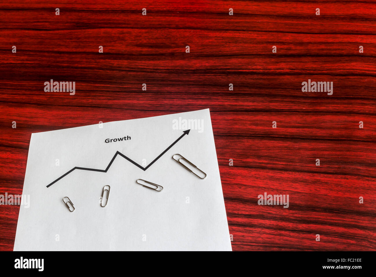 Curve graph printed on a sheet of paper and spreaded paper clips Stock ...