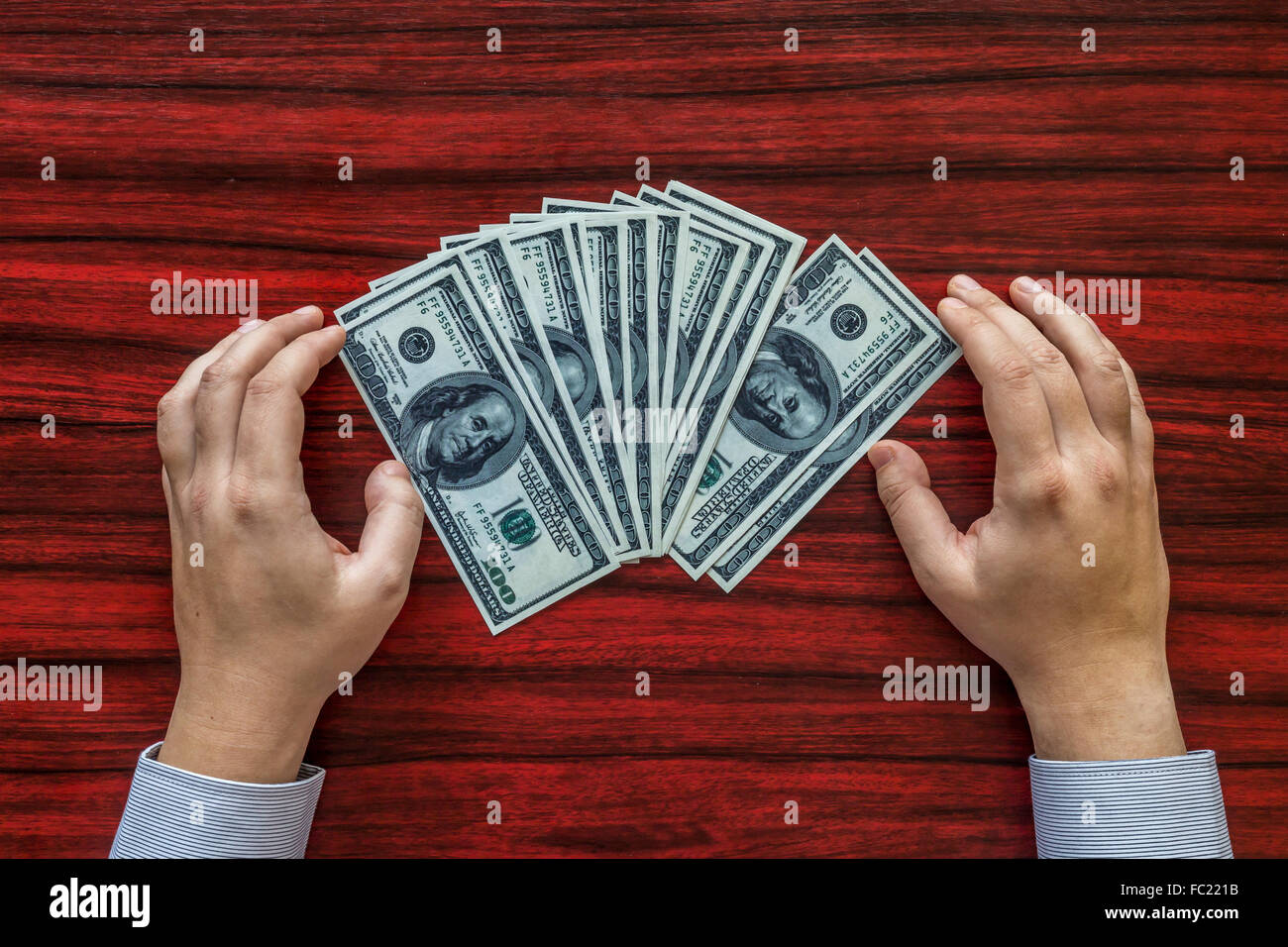 Hands grabbing cash hi-res stock photography and images - Alamy