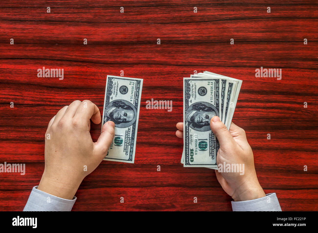 Hands counting money on a desk Stock Photo - Alamy