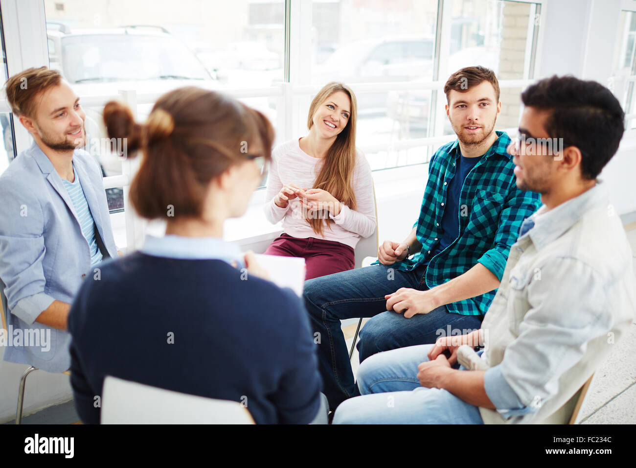 Group of young people communicating at psychological course Stock Photo ...
