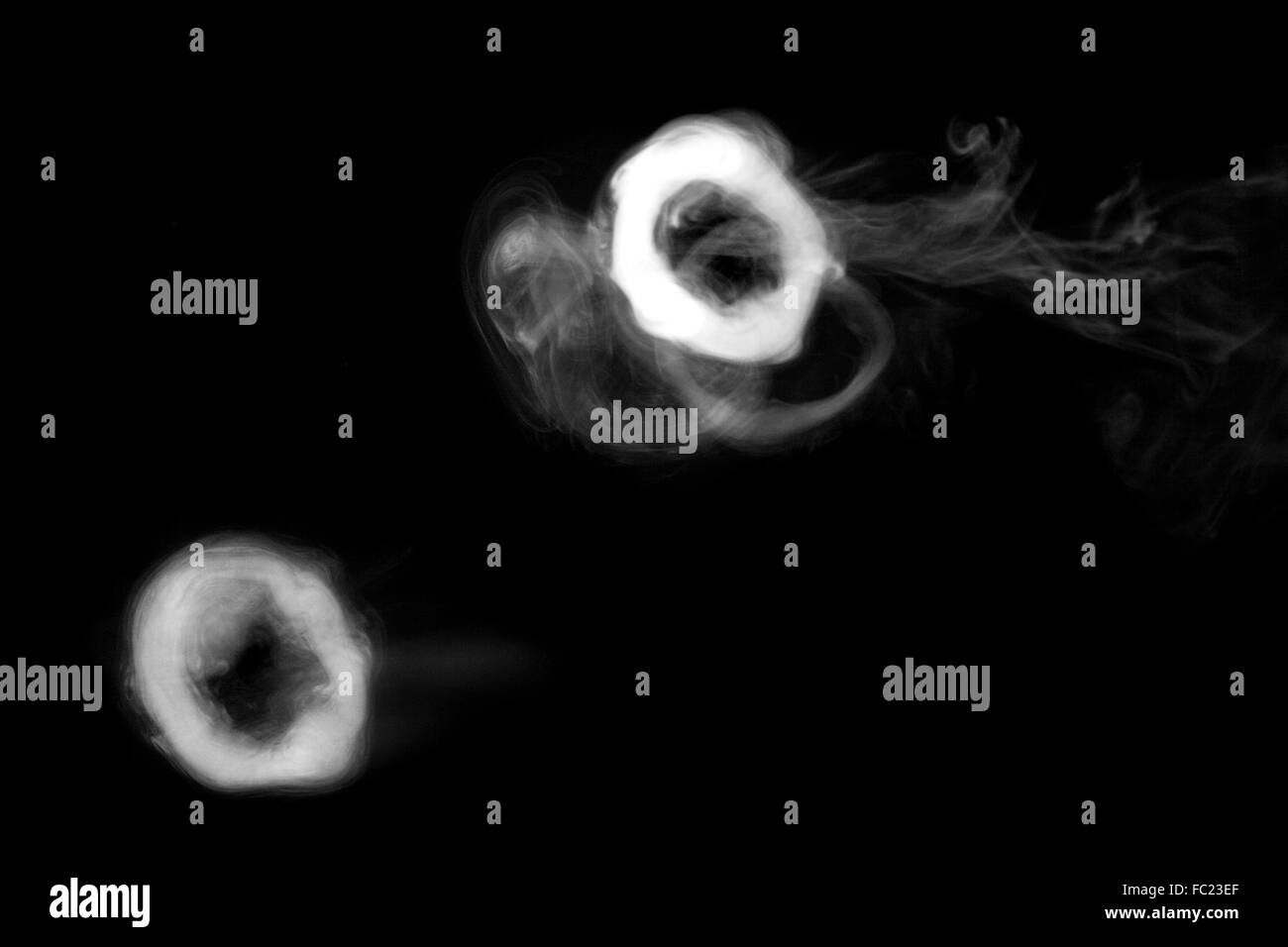 Smoke ring smoke rings Black and White Stock Photos & Images - Alamy