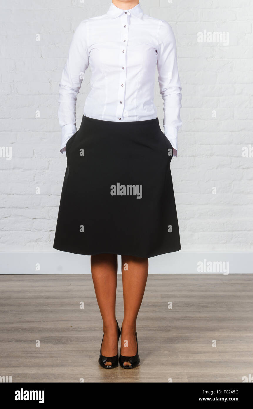 Female black office clothing isolated on white Stock Photo - Alamy