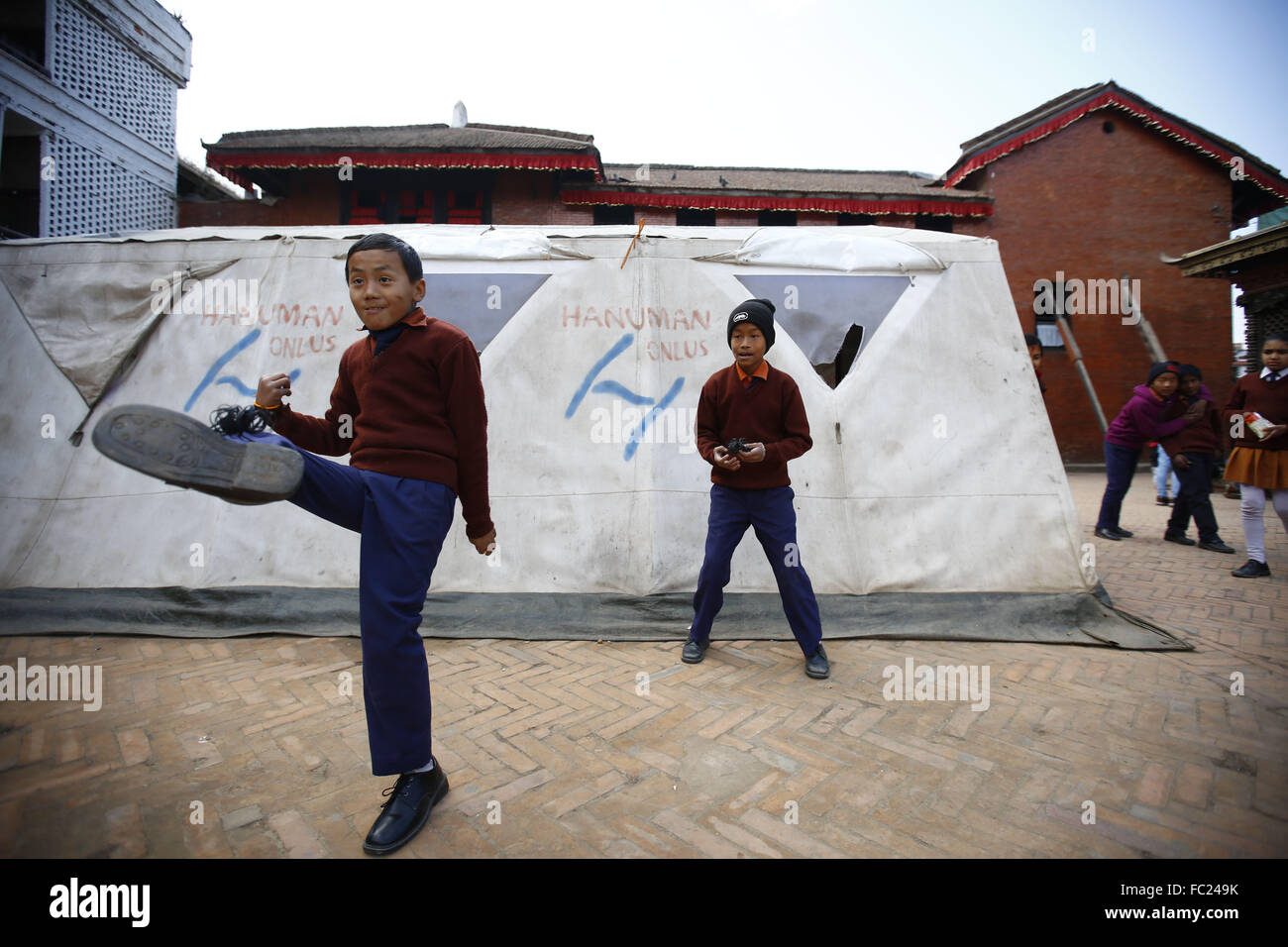 Kathmandu, Nepal. 20th Jan, 2016. A Nepalese school boy playing chungi ...