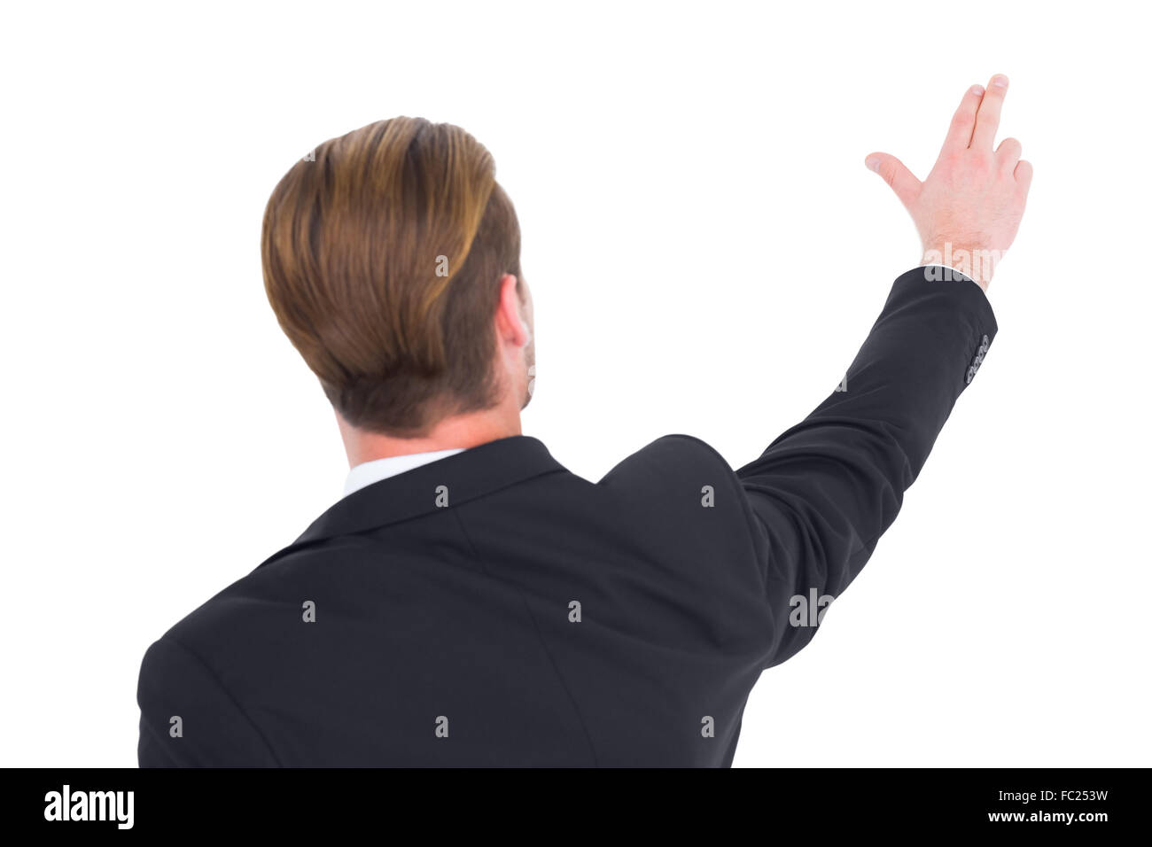 Rear view of businessman pointing with his fingers Stock Photo - Alamy
