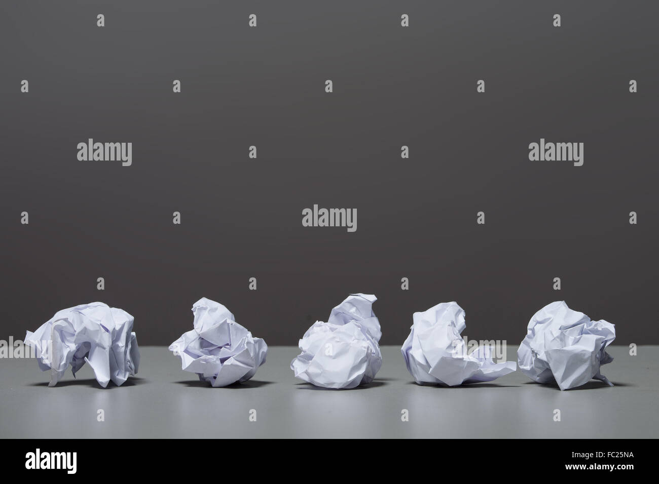 Crumpled paper on a gray background Stock Photo - Alamy