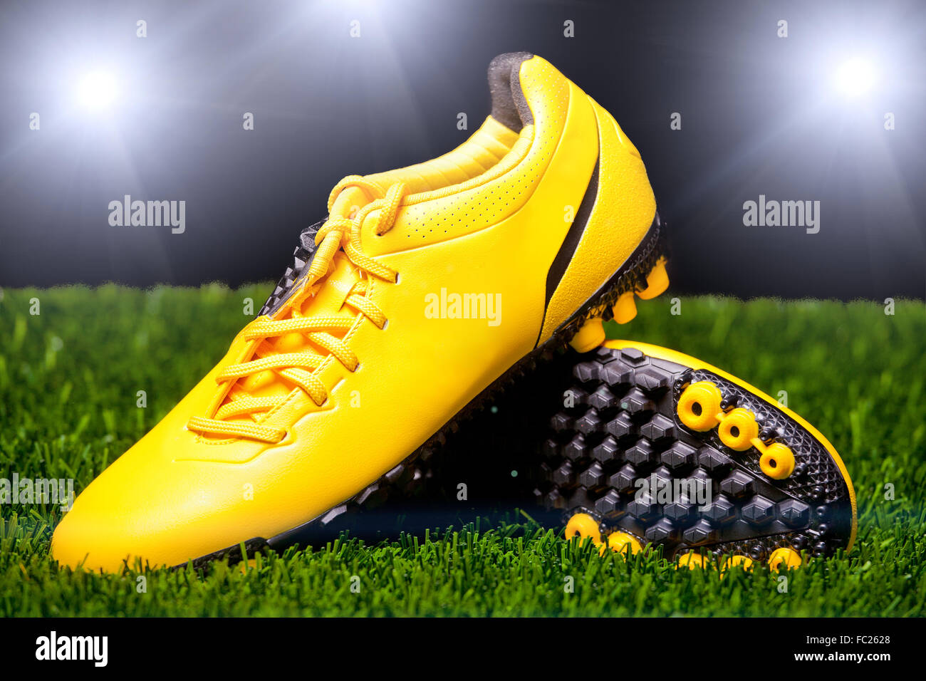Football boots on the grass Stock Photo - Alamy