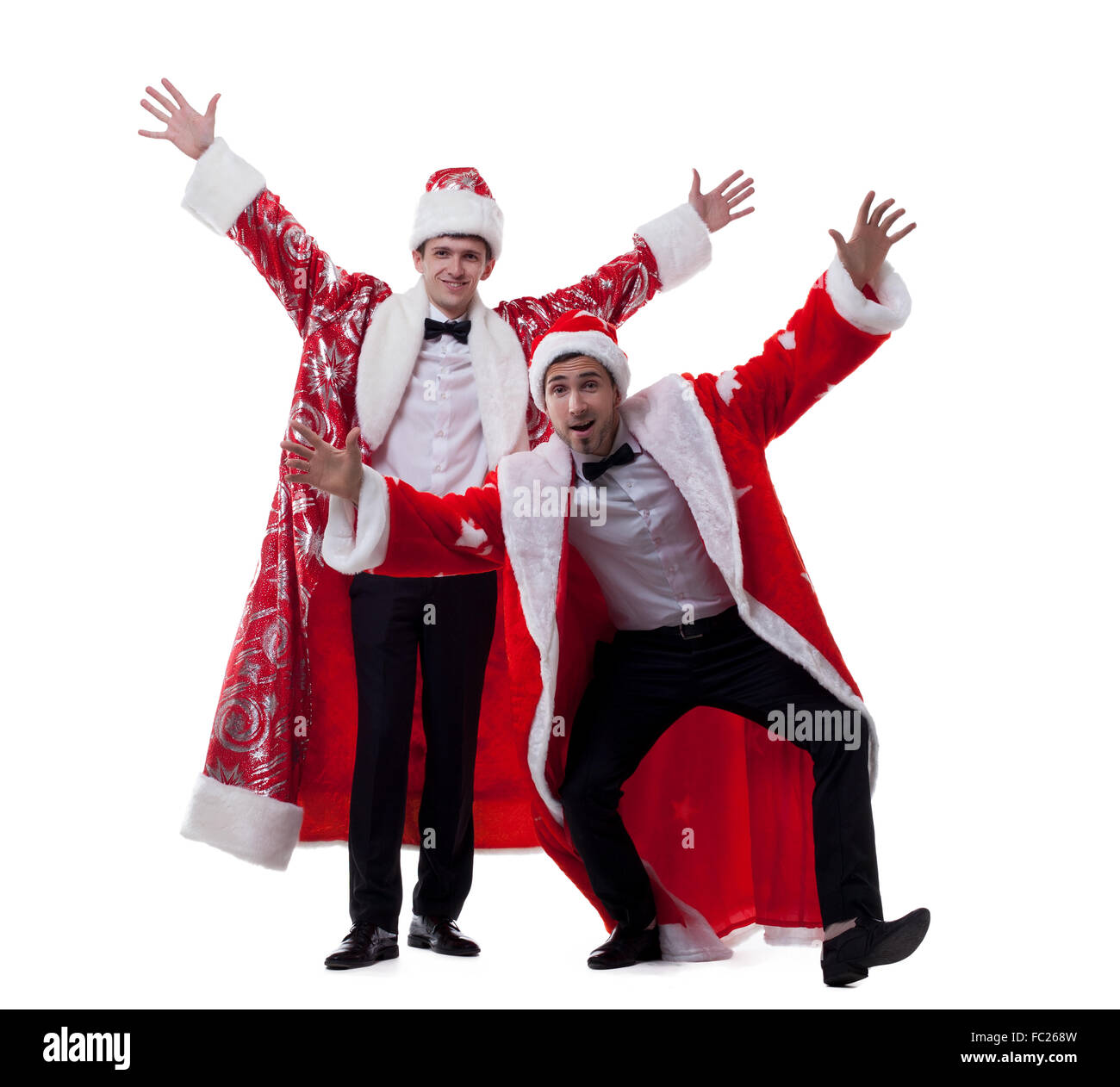 Cheerful men dressed as Santa Claus Stock Photo - Alamy