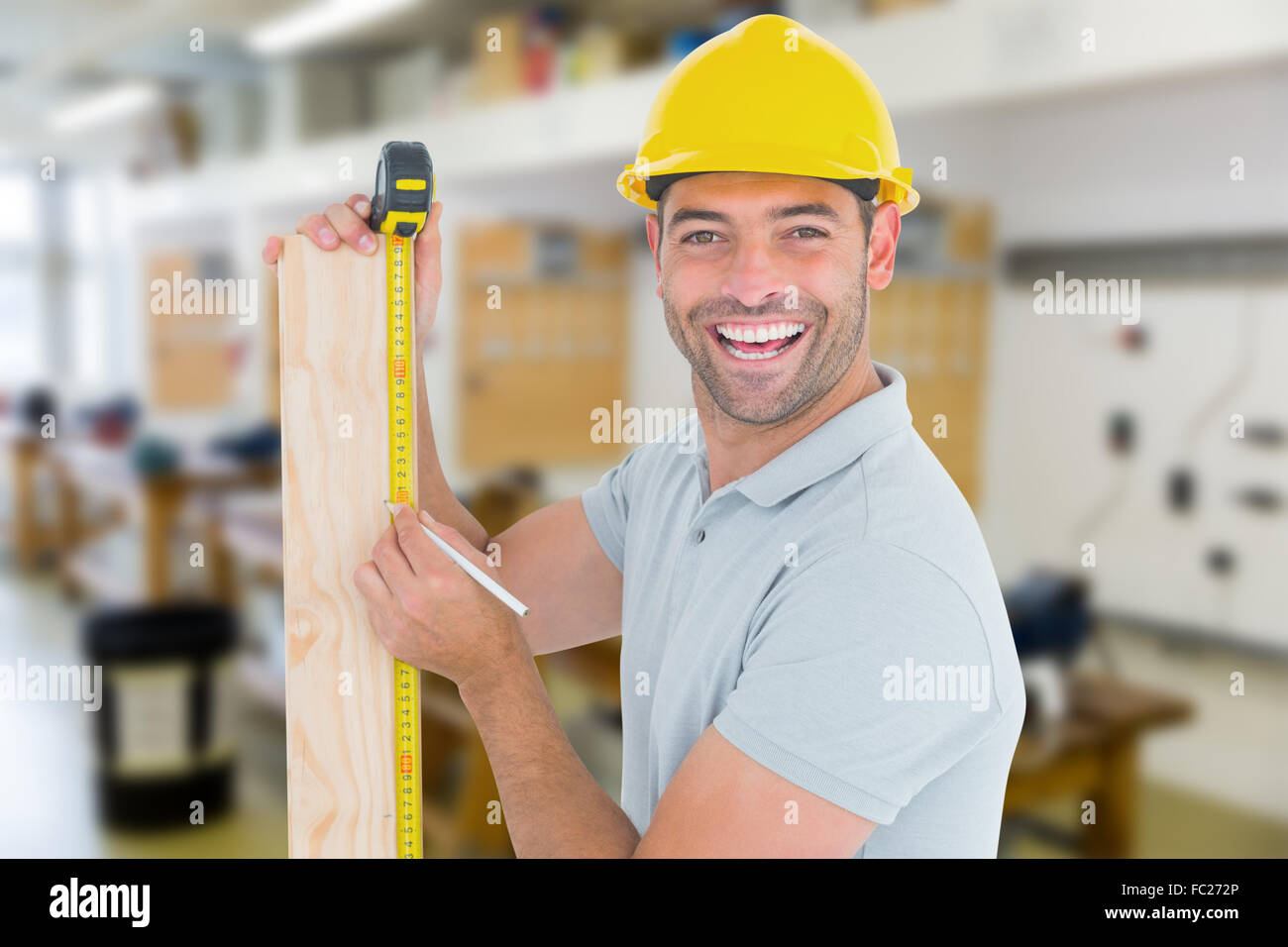 Composite image of construction worker using measure tape to mark on ...