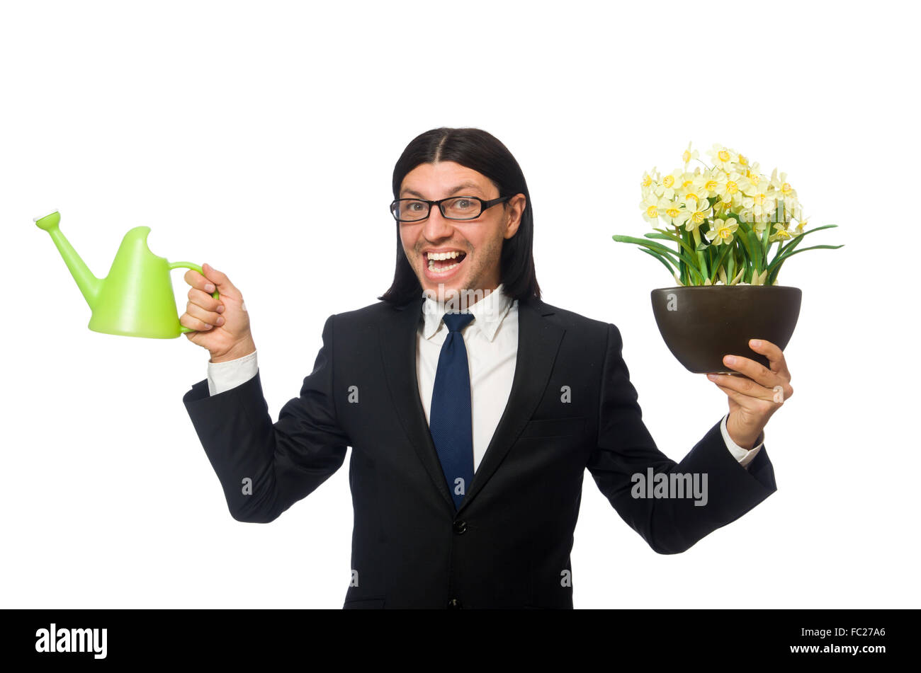 Handsome businessman holding spring flowers isolated on white Stock ...