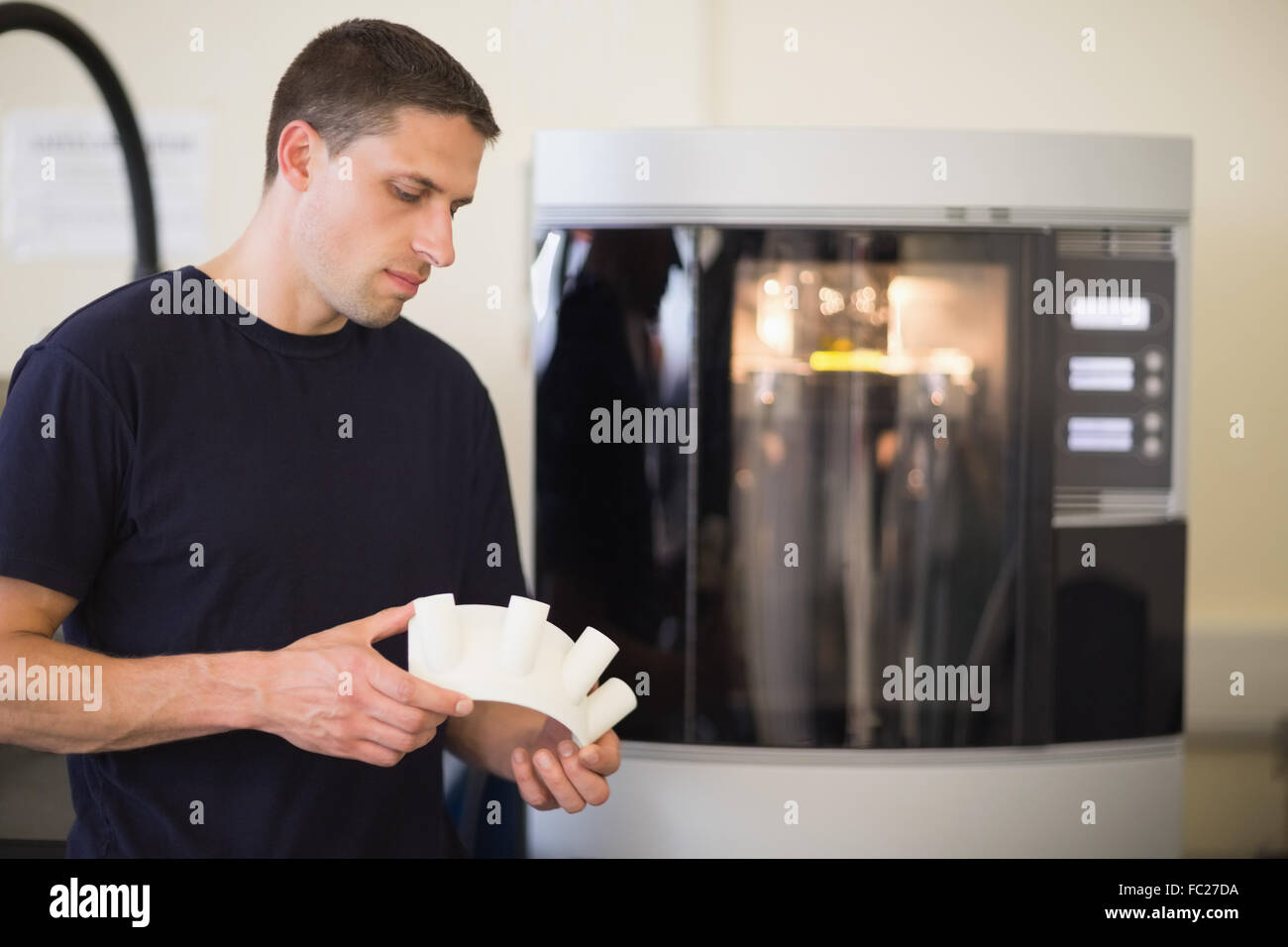 Engineering student holding object printed from 3d printer Stock Photo ...