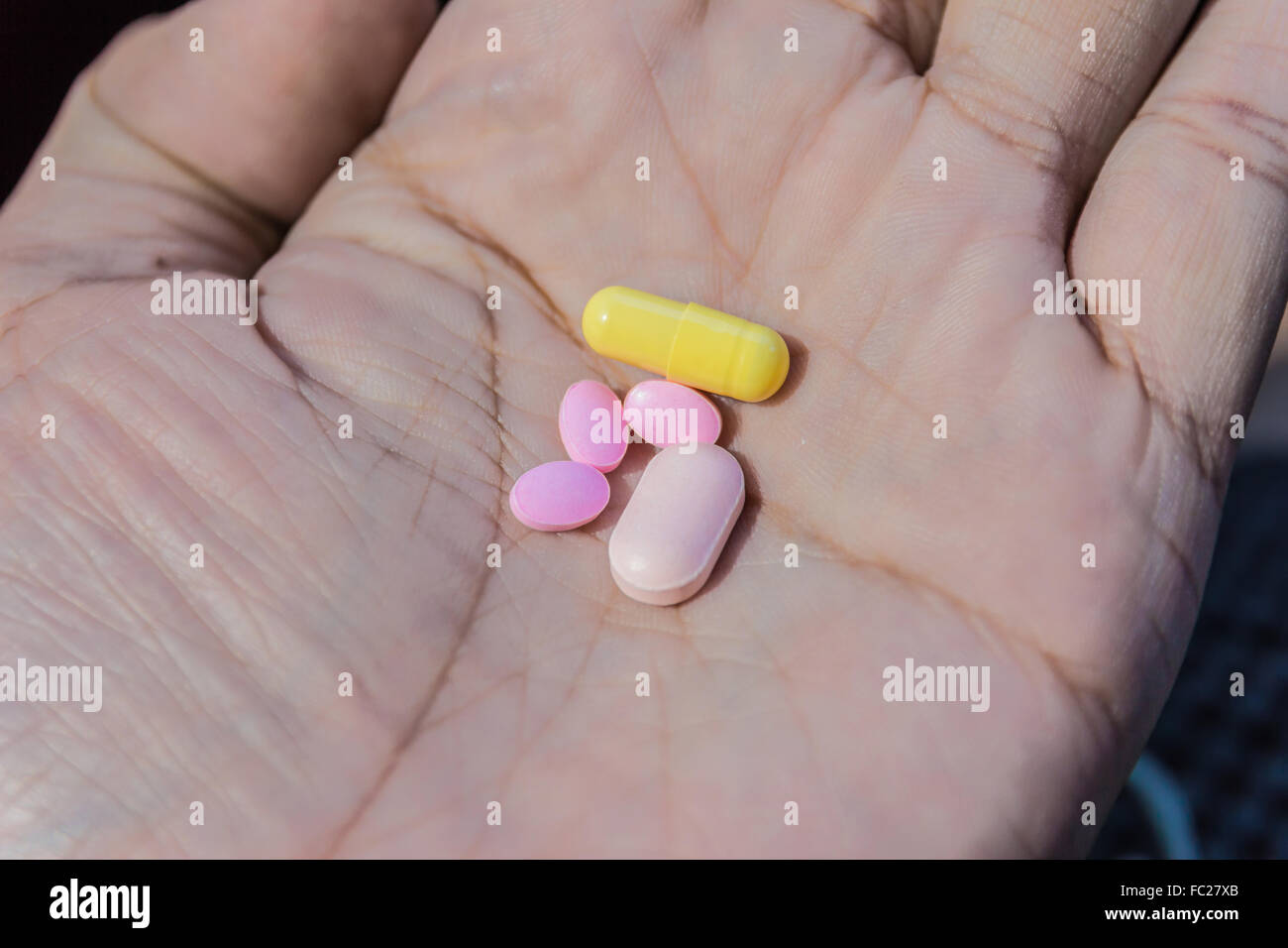 Medicine pills or capsules in hand, palm or fingers. Drug prescription ...