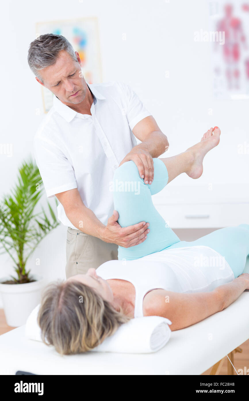 Physiotherapist doing knee massage patient hi-res stock photography and ...