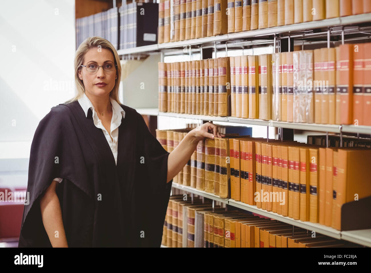 Portrait of a serious lawyer with reading glasses Stock Photo - Alamy