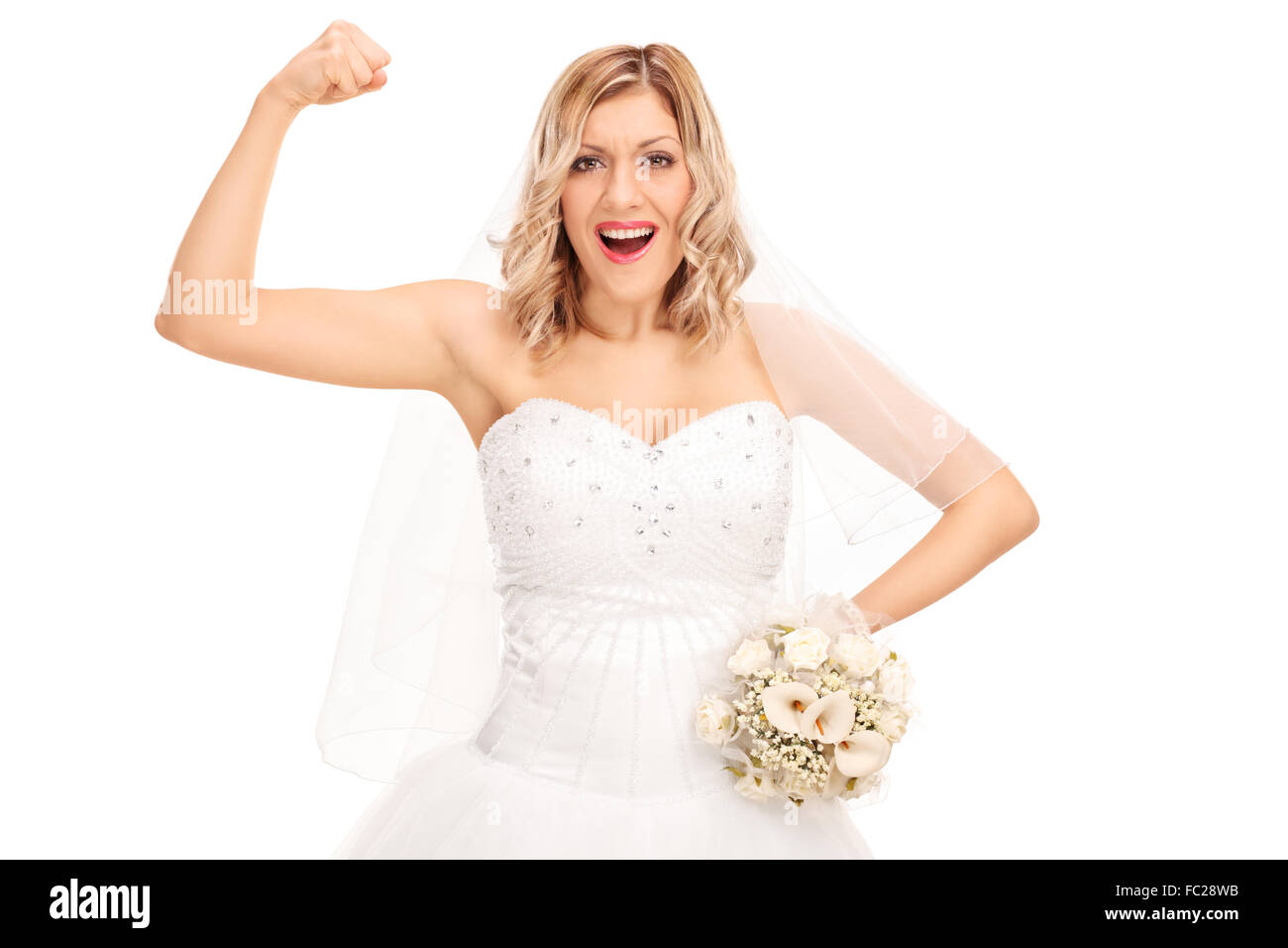 Young blond bride in a white wedding dress flexing her biceps isolated ...