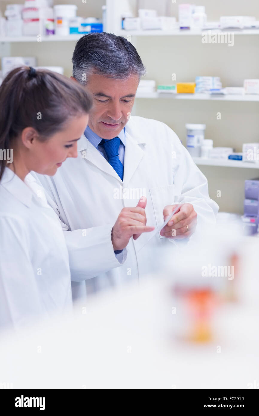 Pharmacist speaking trainee prescription hi-res stock photography and ...