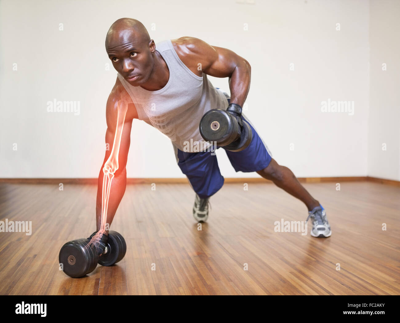 Highlighted arm of strong man lifting weights Stock Photo - Alamy