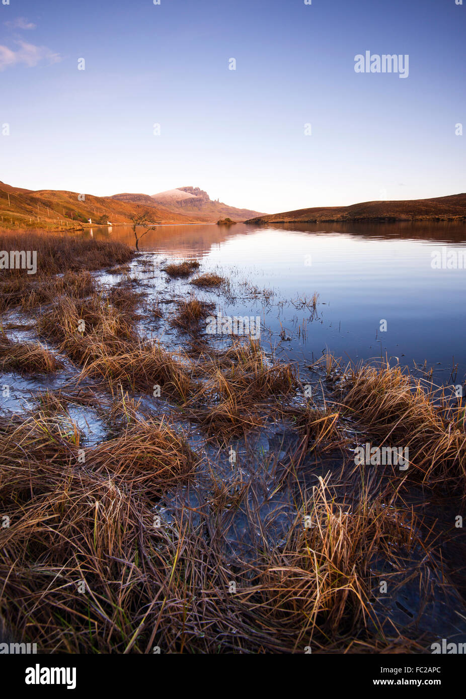 Winter morning at Loch Fada, with a reflection of the Old Man of Storr ...