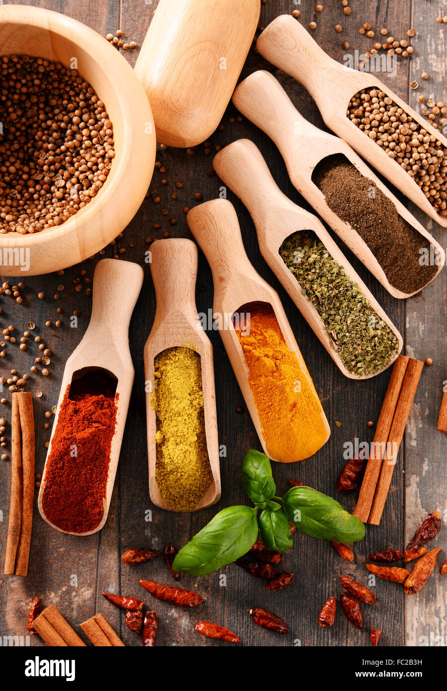 Variety of spices on kitchen table Stock Photo - Alamy