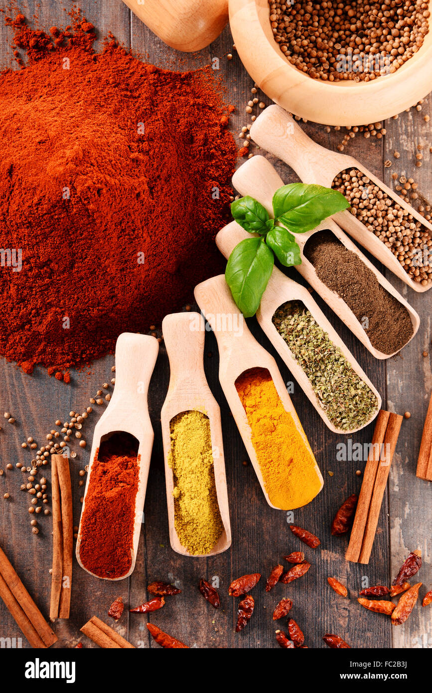 Variety of spices on kitchen table Stock Photo - Alamy