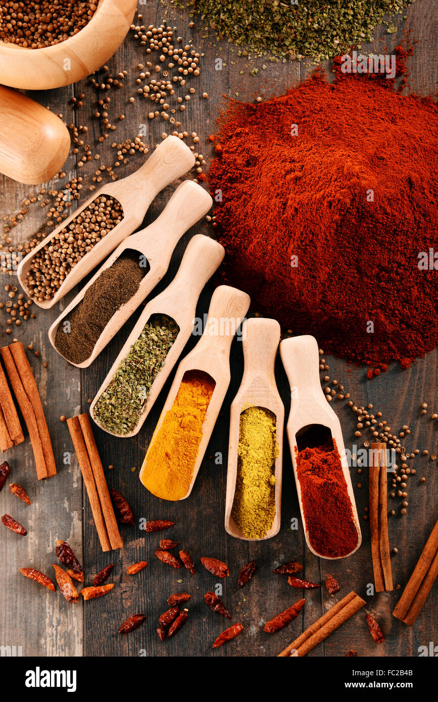 Variety of spices on kitchen table Stock Photo - Alamy