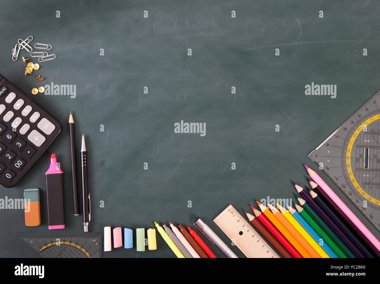 a school blackboard with ruler and set square, besides a calculator ...
