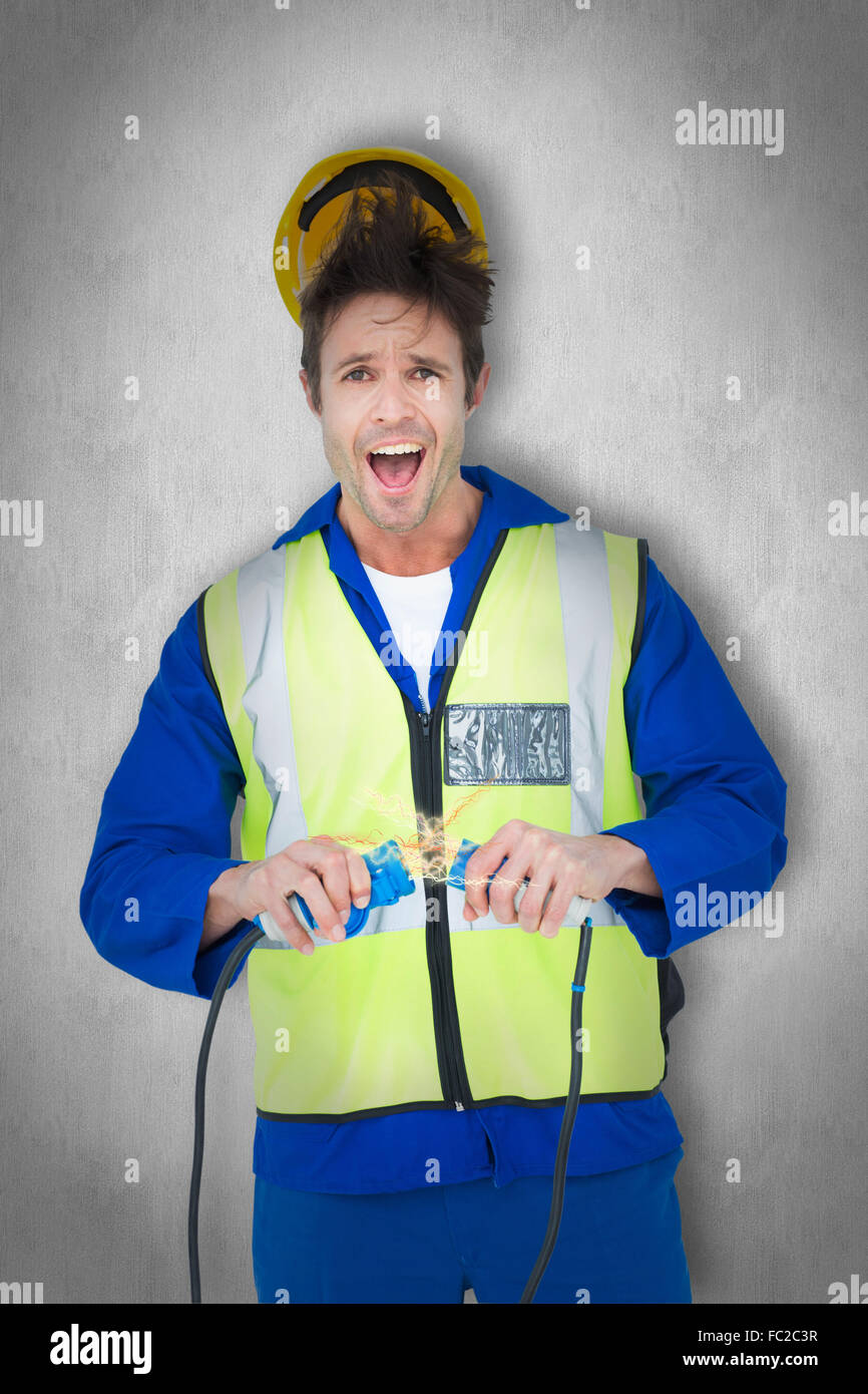 Composite image of electrician getting a shock while holding wires ...