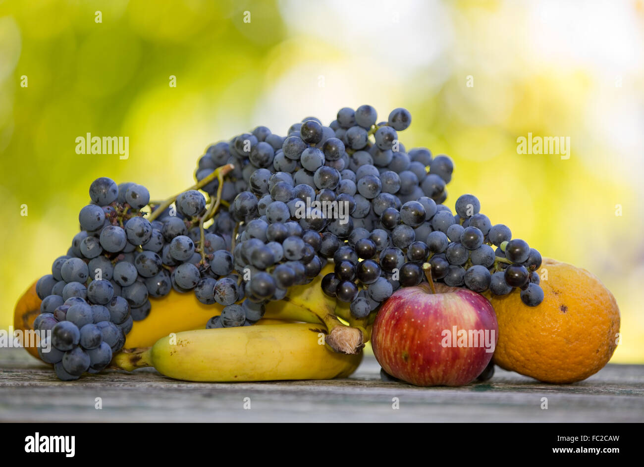 fruits in wooden table outdoor in the garden Stock Photo - Alamy