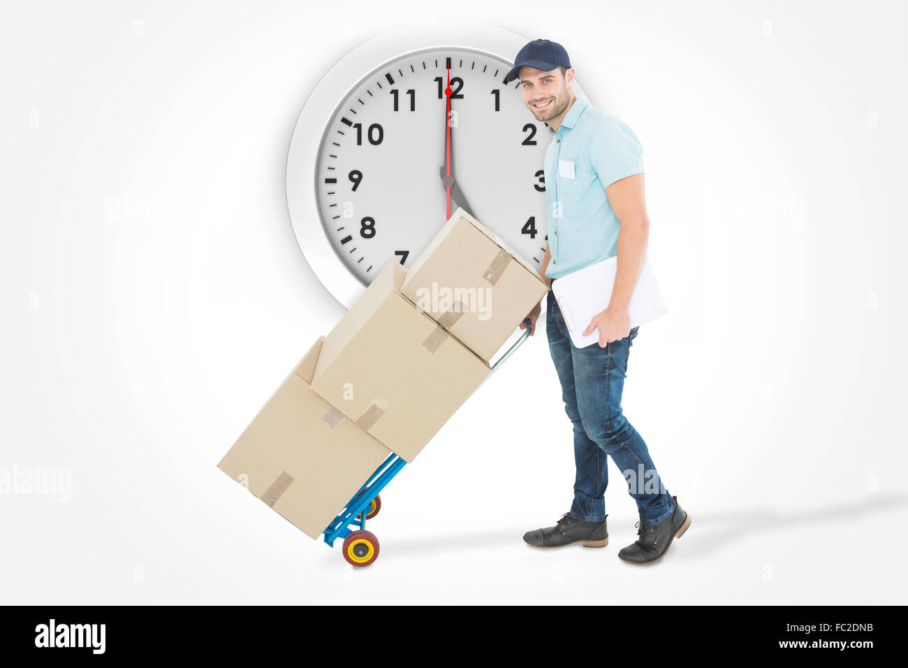 Composite image of confident delivery man pushing trolley of boxes ...